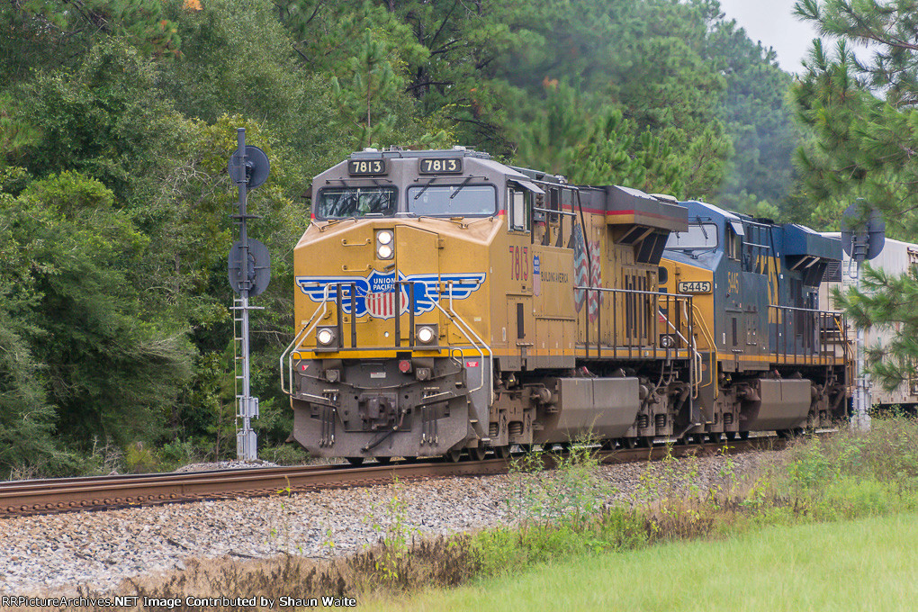 UP 7813 & CSX 5445 wait for a west bound intermodal to pass